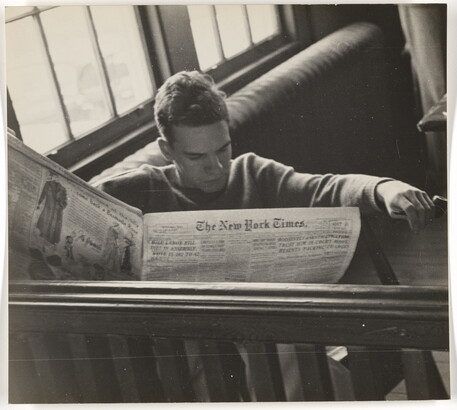 Man reading New York Times, handwritten notes about newspaper headlines ...