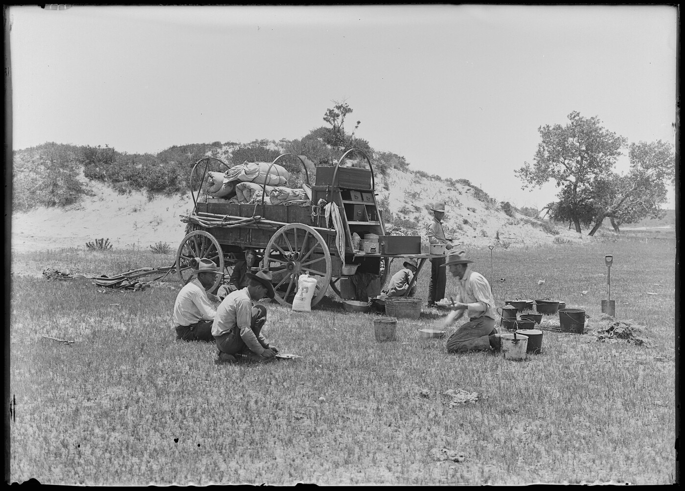 The Spur cowpunchers taking time out for a noonday meal. Spur Ranch ...