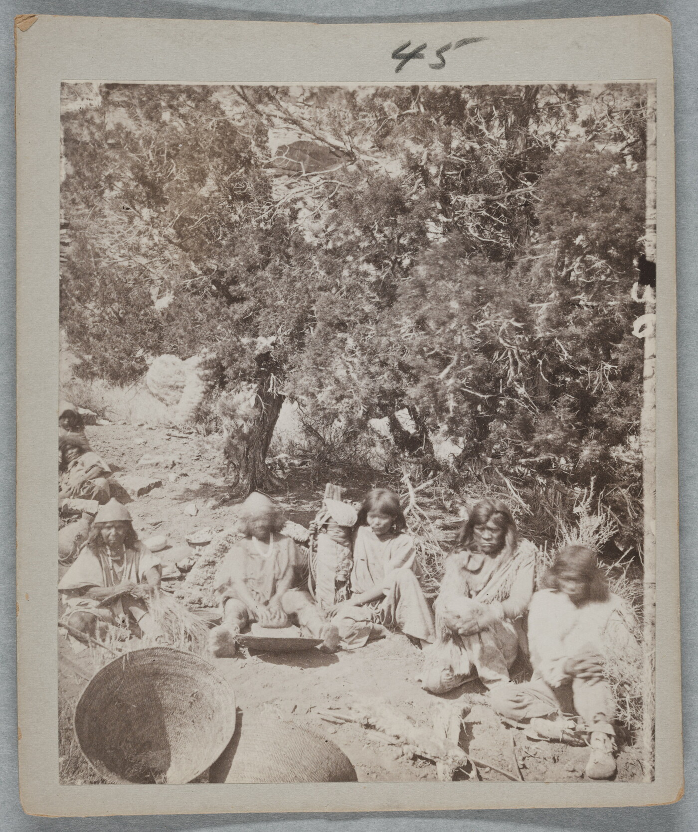 Four Paiute Women in Native Dress; One Weaving Basket, Another Grinding ...