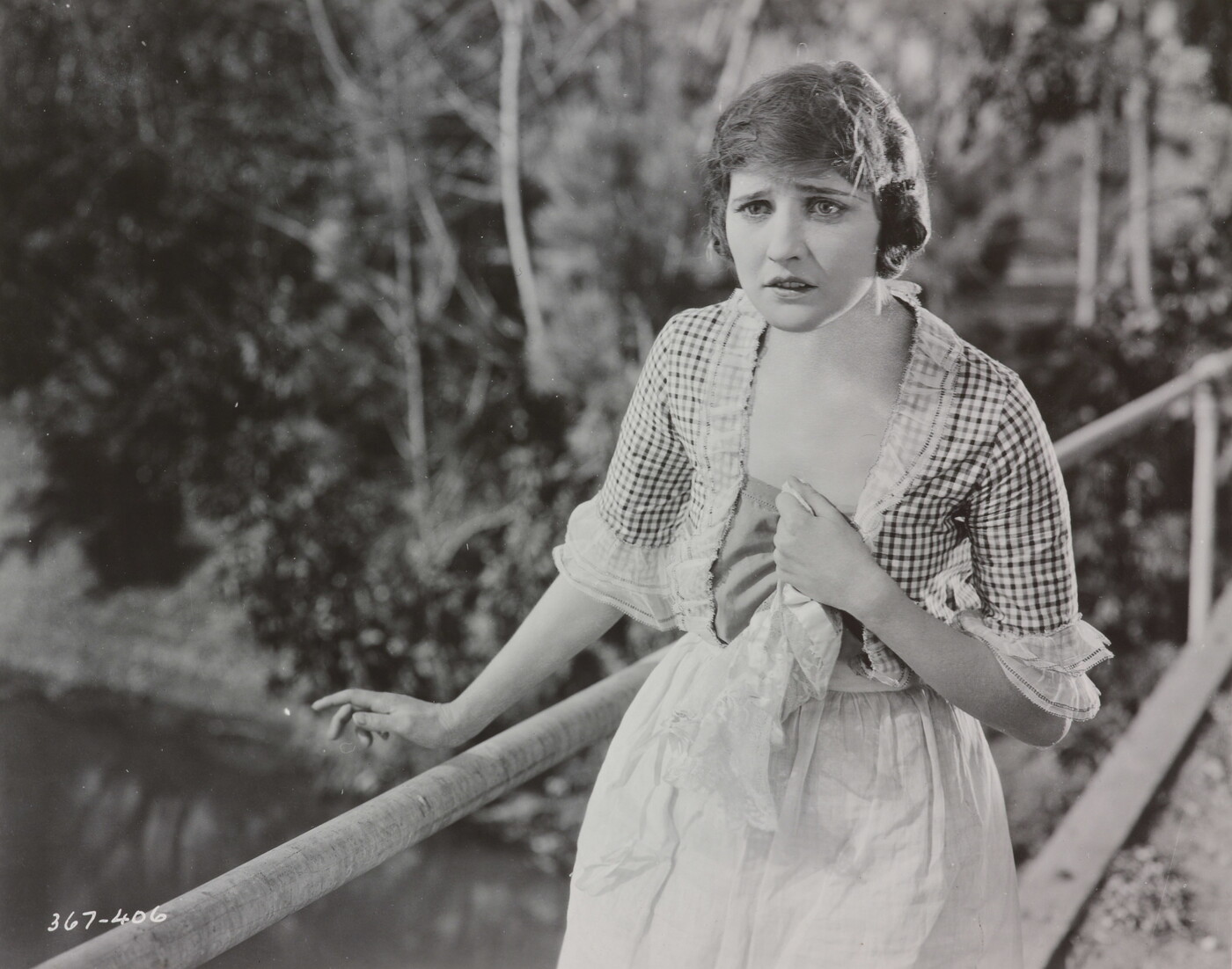 [Agnes Ayres clutching handkerchief, standing on bridge, "Affairs of ...