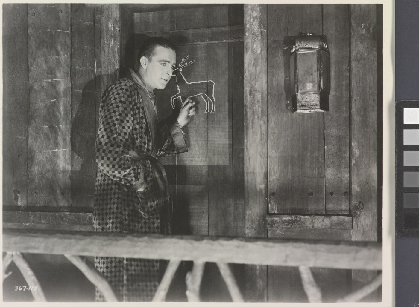 [Wallace Reid knocking on door wearing checkered robe, "Affairs of ...
