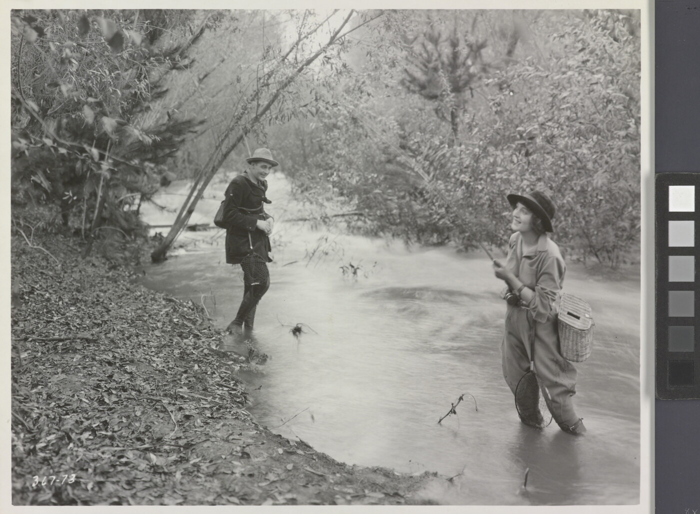 [Dorothy Cumming and Wallace Reid fishing in river, "Affairs of Anatol ...
