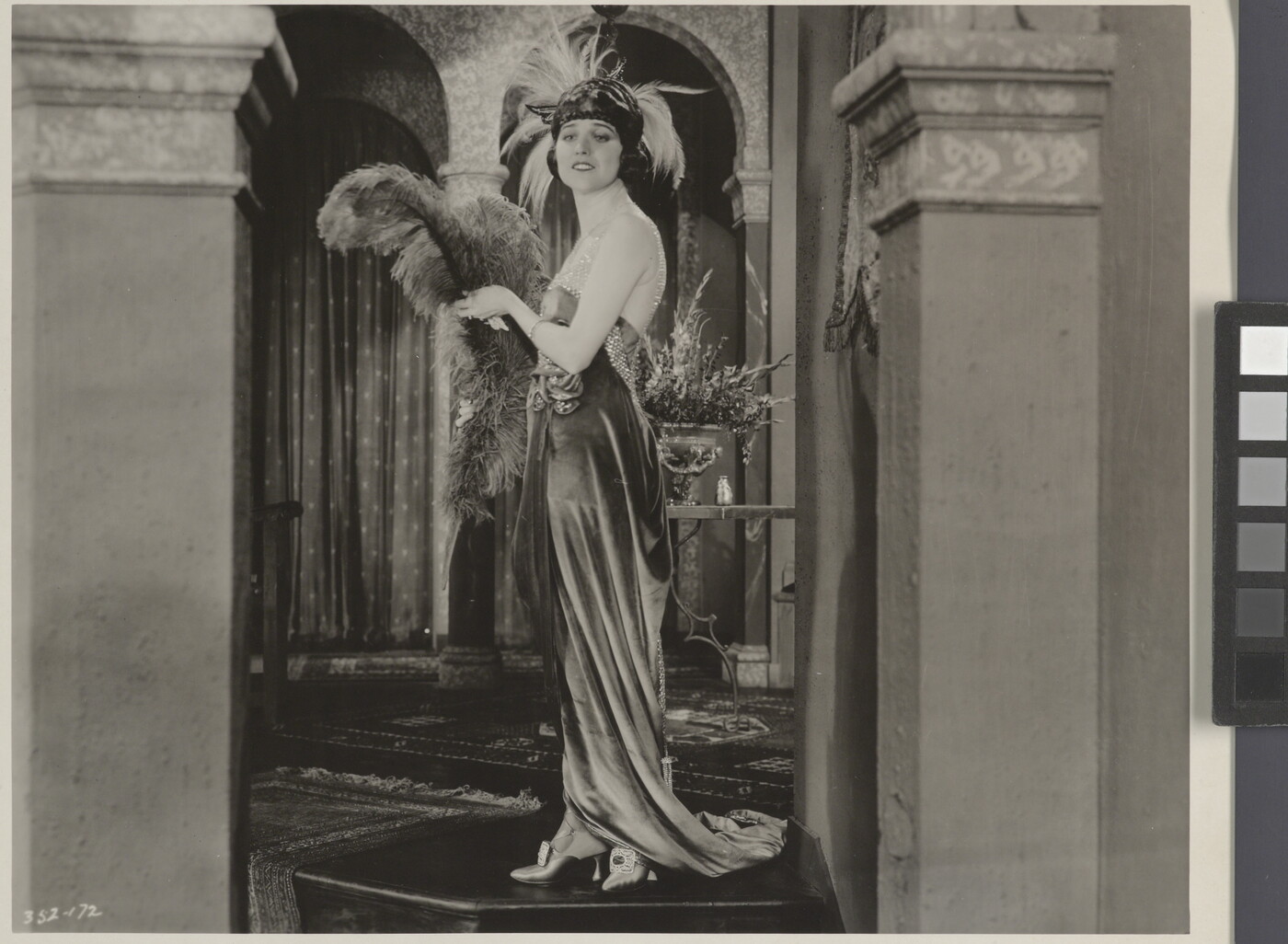[Agnes Ayres in formal wear, standing in archway, "Forbidden Fruit ...