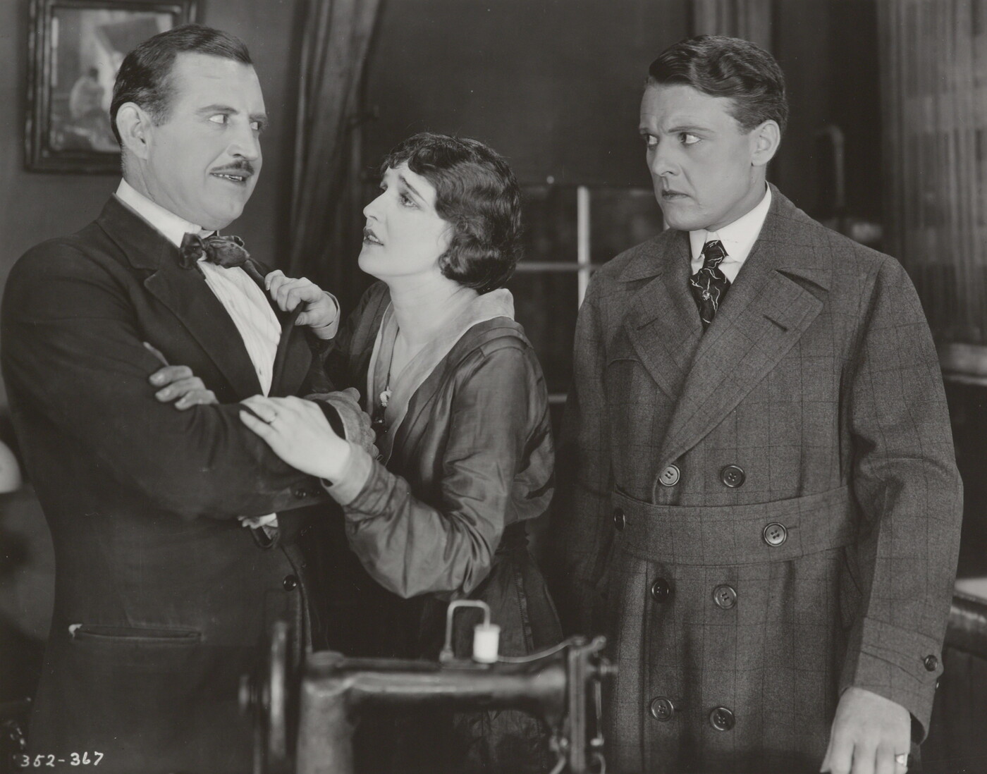 [Agnes Ayres pleading with Clarence Burton, Forrest Stanley looking on ...