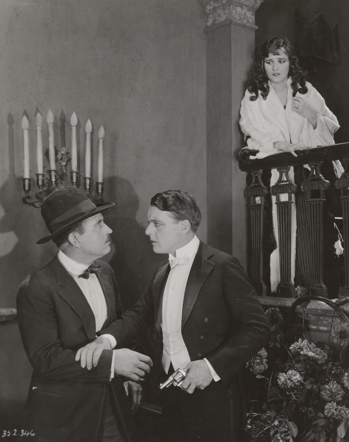 [Forrest Stanley approaching Clarence Burton with pistol, Agnes Ayres ...