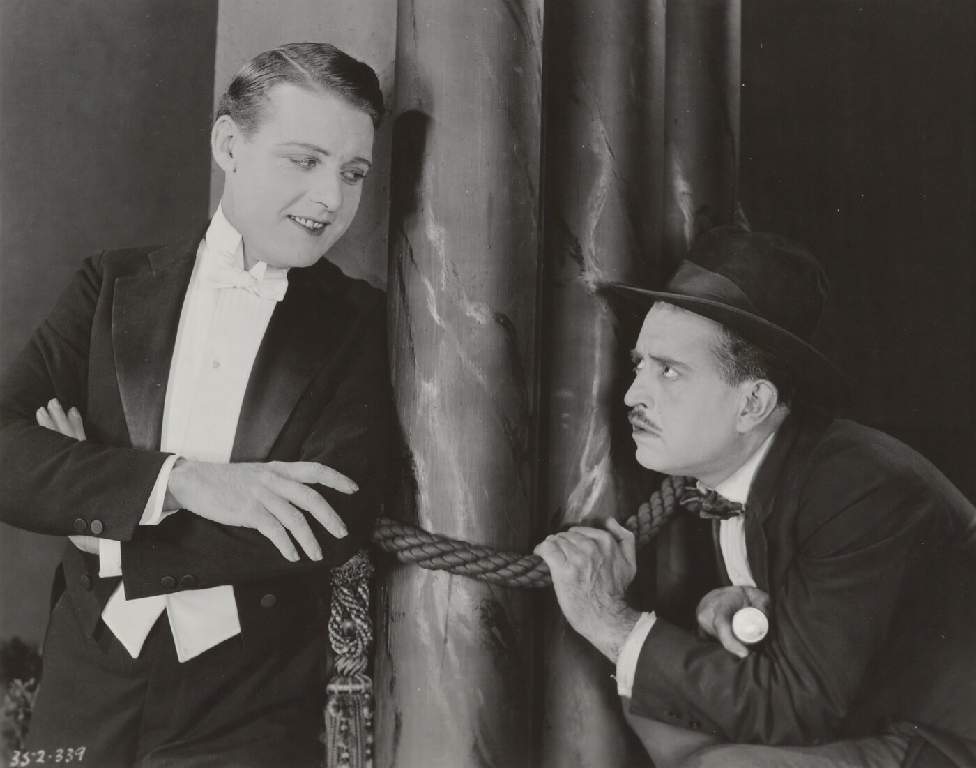 [Forrest Stanley looking around curtain at Clarence Burton, "Forbidden ...