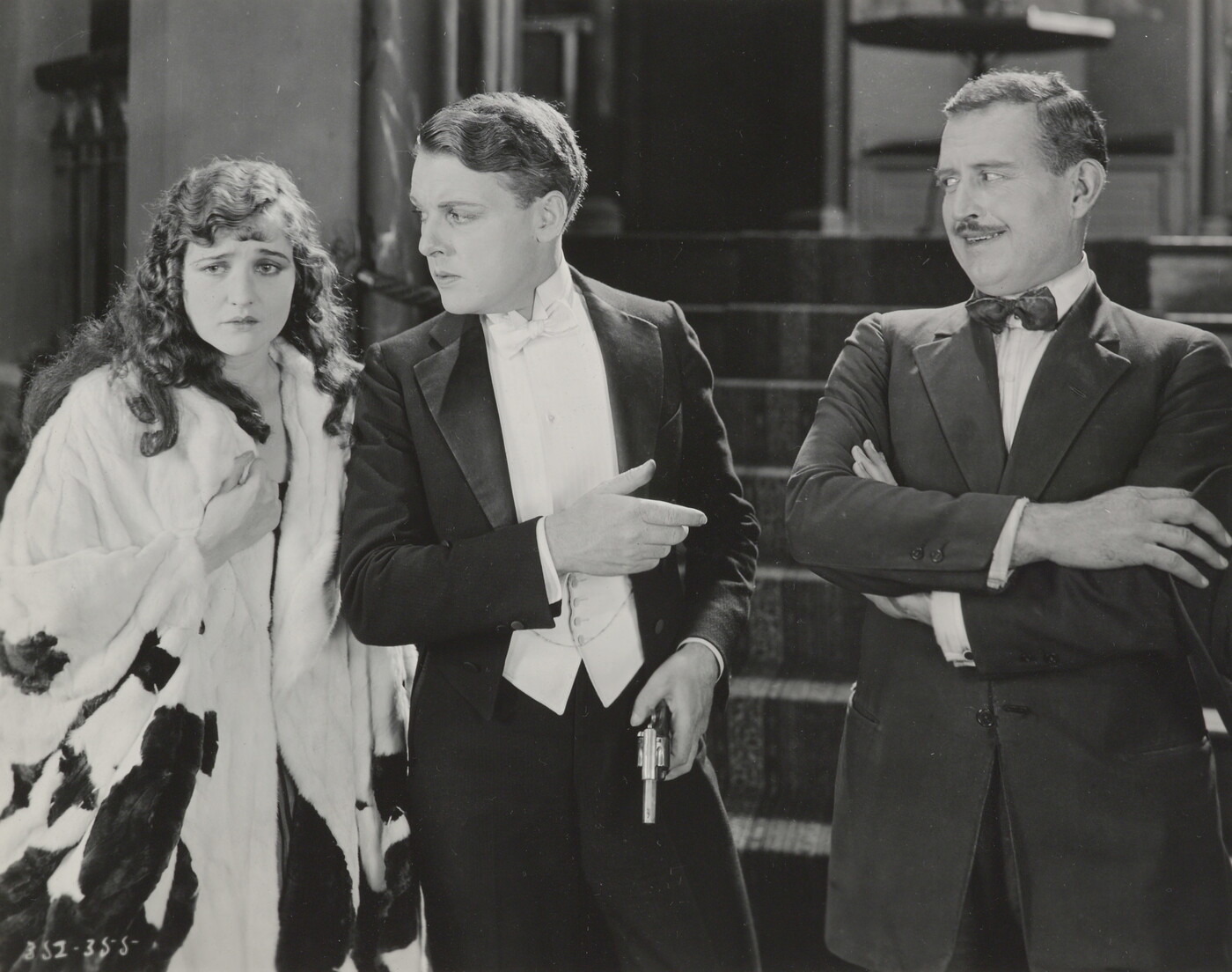 [Forrest Stanley with pistol, speaking to Clarence Burton and Agnes ...