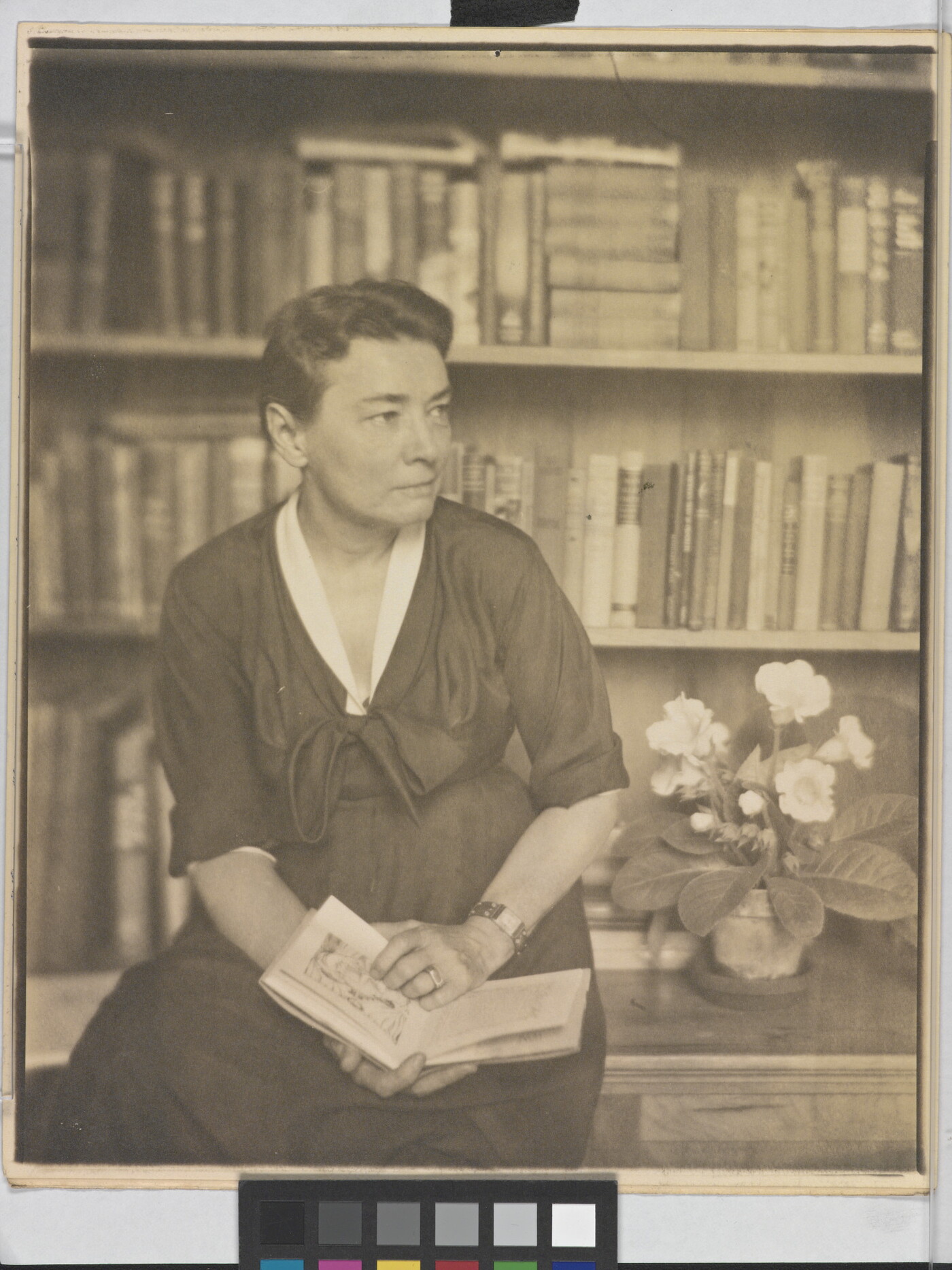 [Phyllis Fenner seated on desk with a book] | Amon Carter Museum of ...