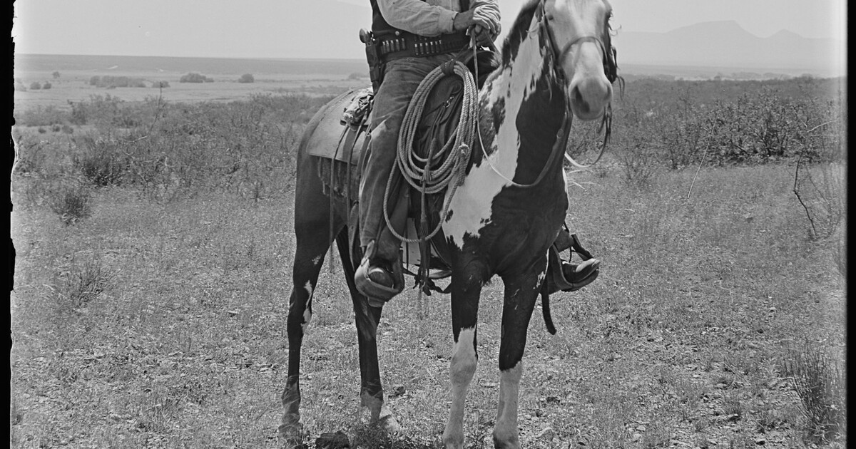 An OR cowpuncher on his paint pony completely outfitted with sixshooter ...