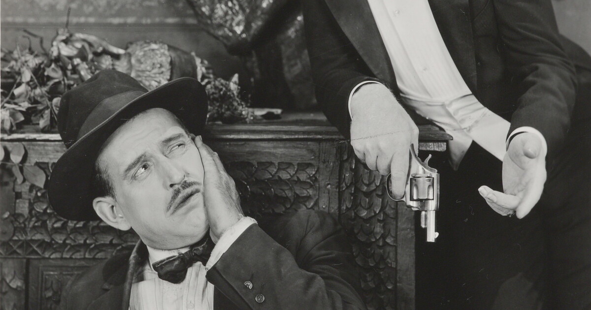 [Forrest Stanley holding seated Clarence Burton at gunpoint, "Forbidden ...